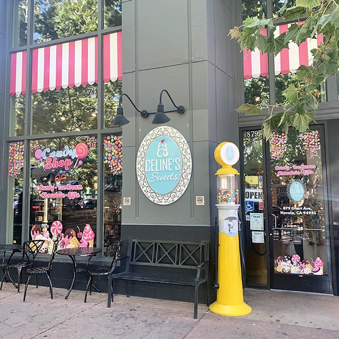The pink-and-white striped awning and cheerful yellow gumball machine stand like sentinels of sweetness, beckoning sugar-seekers into this candy wonderland.