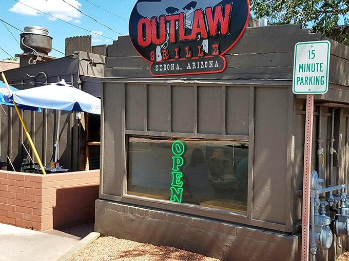 The Outlaw Grille's weathered wooden exterior isn't trying to impress anyone—it's too busy preparing to blow your taste buds away with honest-to-goodness flavor.