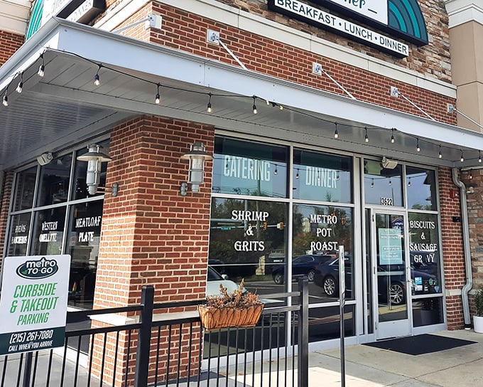 Metro Diner's brick exterior promises comfort before you even step inside, with window signs teasing signature dishes like Shrimp & Grits that'll haunt your food dreams.