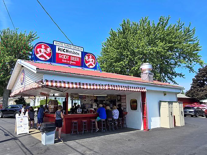 Time travel doesn't require a DeLorean—just a drive to this classic red-and-white awning where Richardson Root Beer and summer memories flow freely.