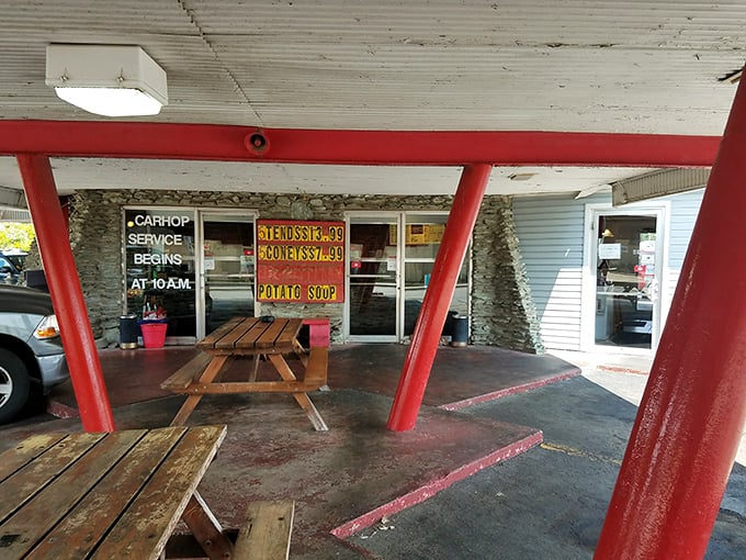 The iconic red pillars of Ray's Drive-In stand like sentinels guarding the promised land of tenderloin. Car hop service begins at 10 AM for those who prefer dining al fresco—in their Buick.