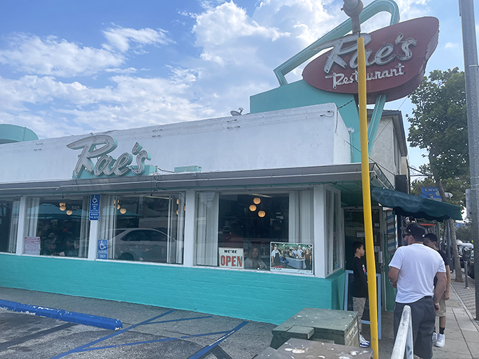 That iconic turquoise exterior isn't just a building—it's a time machine to when diners were the cornerstone of American social life.