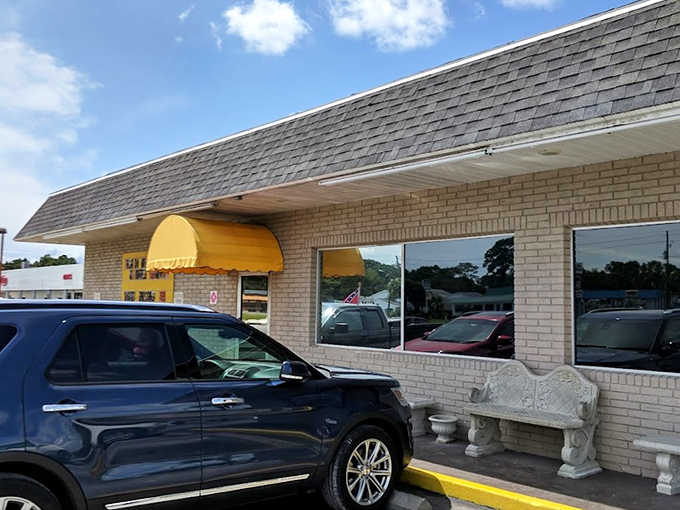 The unassuming brick exterior with its cheerful yellow awning is like a beacon for breakfast lovers. No fancy frills needed when the food speaks volumes.