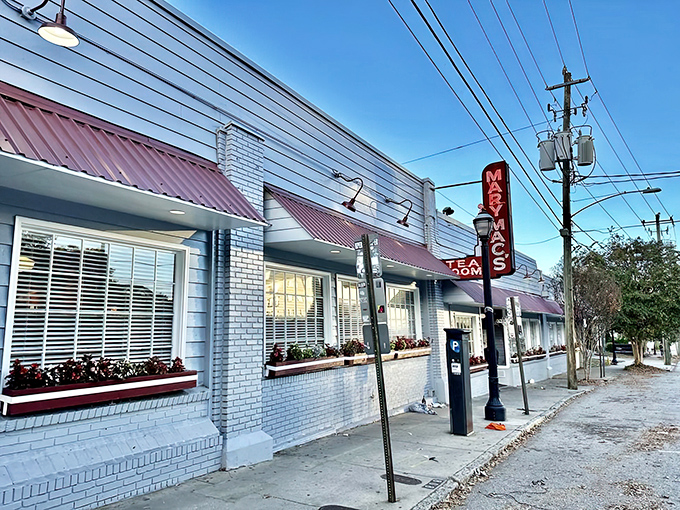 The iconic white brick exterior with burgundy awnings stands as Atlanta's culinary time machine, beckoning hungry souls with its vintage charm.