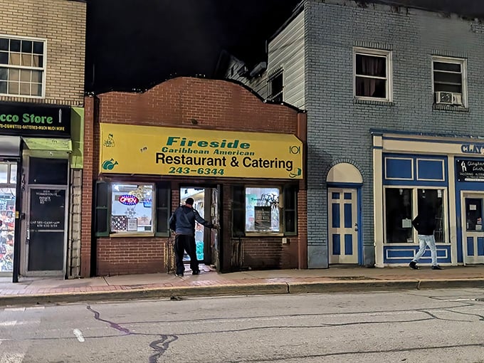 The bright yellow sign beckons like a tropical sun in Pittsburgh's urban landscape, promising Caribbean flavors that transport you far beyond Pennsylvania.