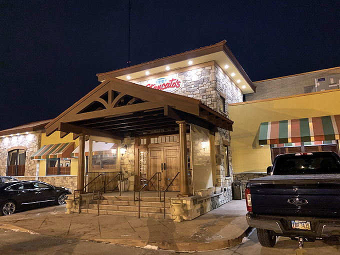 The stone and stucco exterior of Stancato's stands like a culinary fortress, its red-tiled roof and striped awnings promising Italian treasures within.