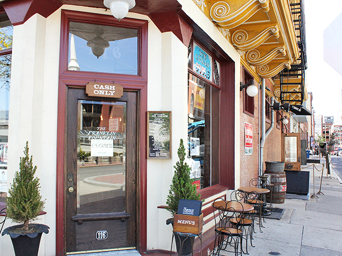Step through this burgundy-trimmed doorway and prepare to time travel. The "CASH ONLY" sign is your first clue that authenticity trumps convenience here.