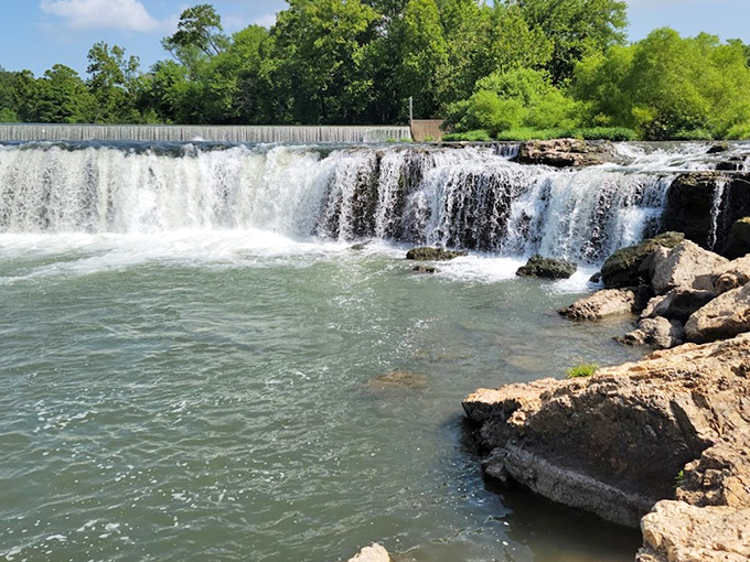 Nature's perfect horseshoe design spills over ancient chert ledges, creating Missouri's largest continuously flowing waterfall—a geological masterpiece hiding in plain sight.