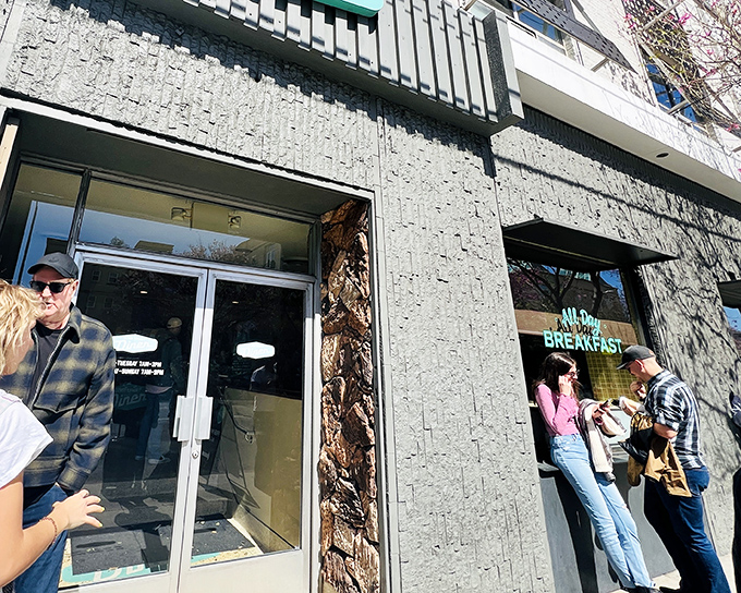 The textured stone facade of Clark Street Diner whispers tales of Hollywood's golden era while that neon sign promises comfort food worth writing home about.