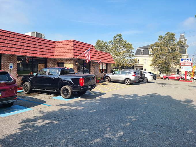 The iconic red-roofed brick building with American flags proudly waving says everything you need to know—comfort food and patriotism served in equal measure.