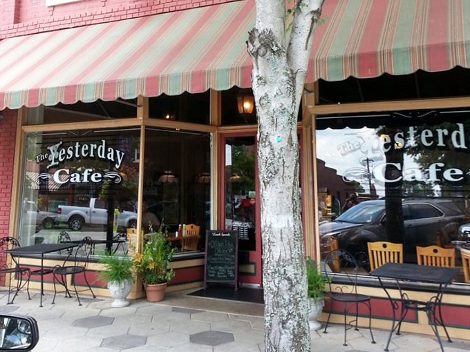 The classic red brick and striped awning exterior isn't just charming—it's the gateway to buttermilk pie paradise. Small-town America at its most delicious.