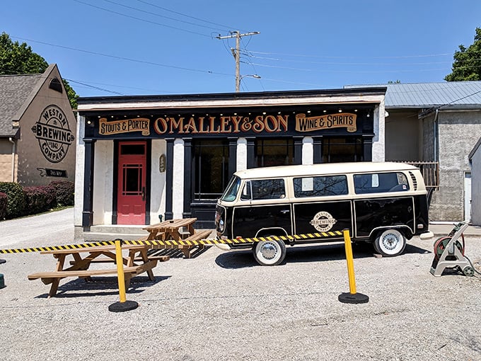 That red door isn't just an entrance—it's a portal to underground beer paradise. O'Malley's classic storefront gives only the slightest hint of what awaits below.