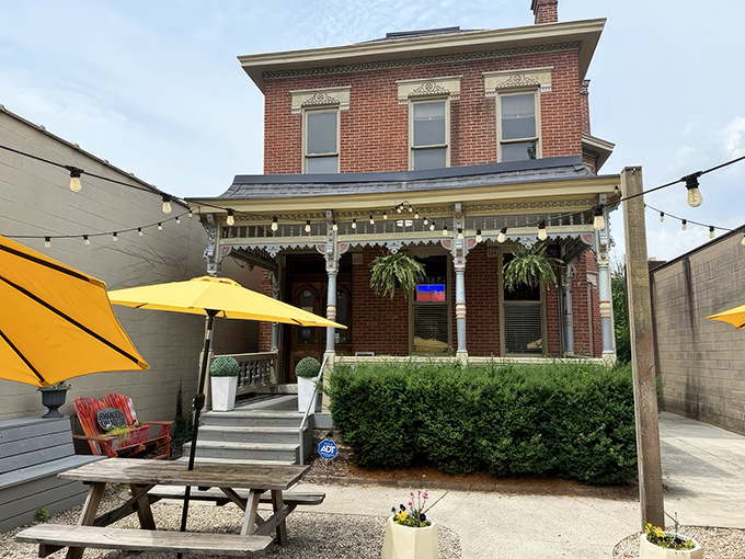 Victorian charm meets barbecue brilliance in this historic brick building. The yellow umbrellas practically scream, "Come get happy on our patio!"