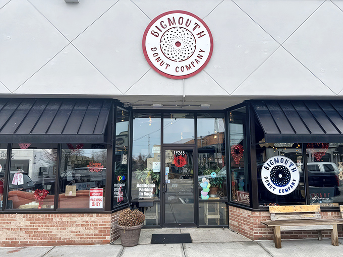 The unassuming storefront of Bigmouth Donut Company beckons with its clean white facade and distinctive circular logo—proof that donut paradise often hides in plain sight.