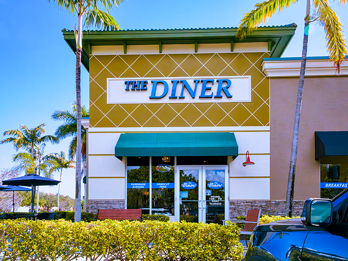 Palm trees standing guard outside The Diner like tropical maître d's welcoming you to breakfast paradise in Boynton Beach.