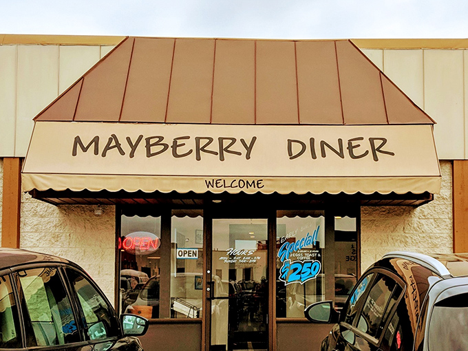 The modest exterior of Mayberry Diner belies the culinary treasures within. Those red awnings have sheltered generations of hungry Toledoans seeking comfort food paradise.