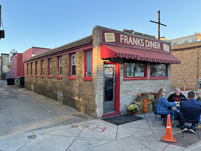 Frank's Diner stands proudly in downtown Kenosha, its brick exterior and cherry-red awning beckoning hungry travelers like a culinary lighthouse on Lake Michigan's shore.