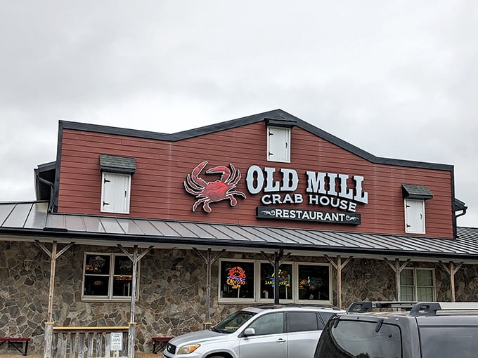 The iconic red exterior of Old Mill Crab House stands proudly in Delmar, where that giant crab sign has been beckoning hungry travelers for decades.