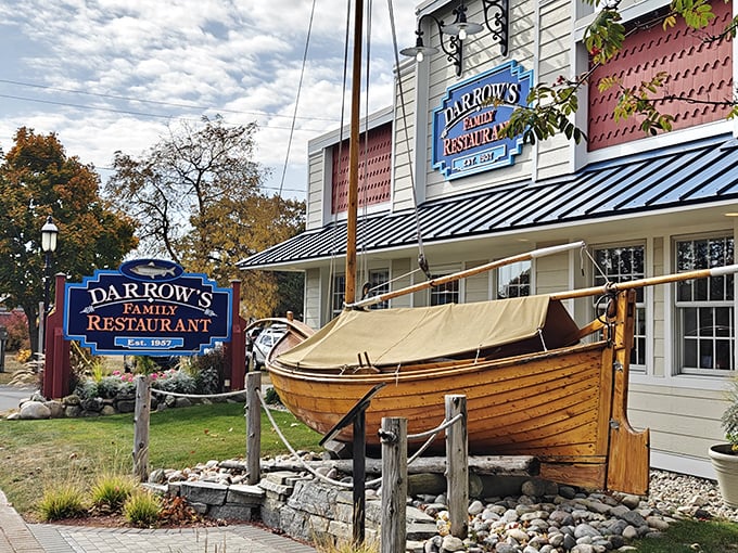 The wooden boat outside isn't just decoration—it's a promise of the maritime treasures awaiting inside this unassuming Mackinaw City landmark.