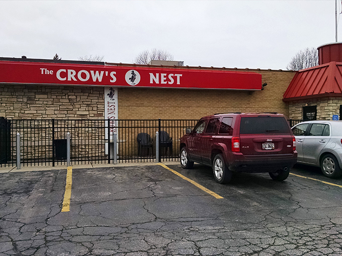 The bright red awning of The Crow's Nest stands out like a culinary lighthouse on Ashtabula's landscape, beckoning hungry travelers with promises of Italian-American comfort.