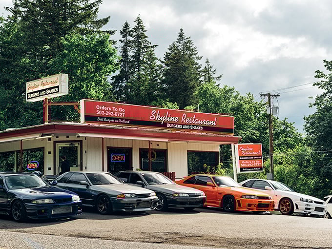 The unassuming exterior of Skyline Restaurant stands like a time capsule among Portland's towering firs, promising burger bliss since 1935.