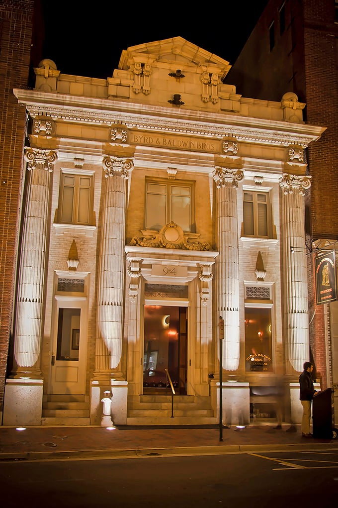 The grand neoclassical façade of Byrd & Baldwin Bros Steakhouse glows like a culinary temple at night, beckoning hungry pilgrims with promises of carnivorous delights.