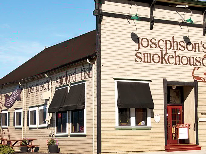 The unassuming beige building with black awnings stands like a sentinel of smoke and seafood, promising treasures that have lured Oregonians to Astoria for generations.