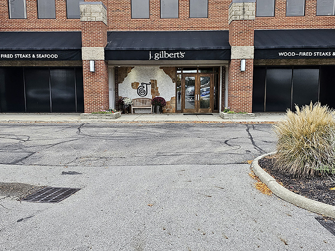 The brick façade of J. Gilbert's stands proudly in Worthington, promising wood-fired delights within those walls that have witnessed countless celebration dinners.