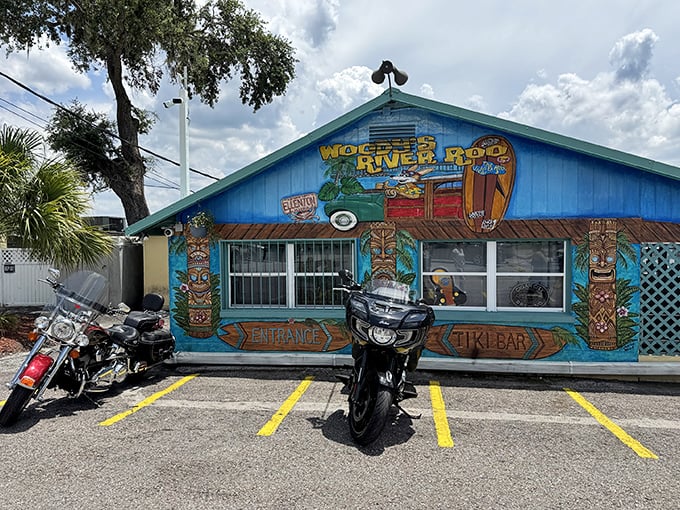 The unassuming yellow exterior of Woody's River Roo might not scream "culinary destination," but that thatched tiki roof whispers "come as you are" with all the charm of Old Florida.