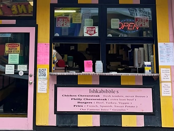 The unmistakable yellow and pink facade of Ishkabibble's stands out on South Street like a delicious beacon for hungry cheesesteak pilgrims.
