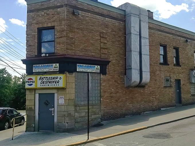 The unassuming brick exterior of Triangle Bar & Grill stands like a sandwich fortress in Swissvale, proudly announcing its naval-themed sandwich arsenal to Pittsburgh's hungry masses.