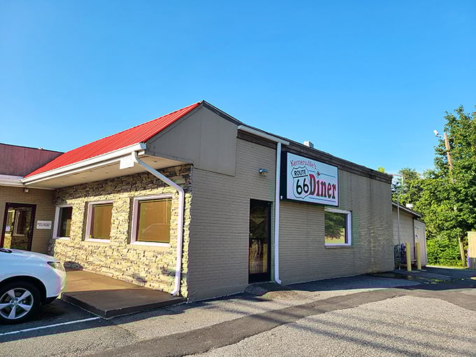 The iconic red roof and stone facade of Route 66 Diner beckons hungry travelers like a roadside oasis in Kernersville.