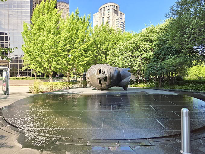 "Eros Bendato" lounges in his reflecting pool like someone who fell asleep during a spa day. Downtown St. Louis skyscrapers create the perfect backdrop for this iconic bronze head.