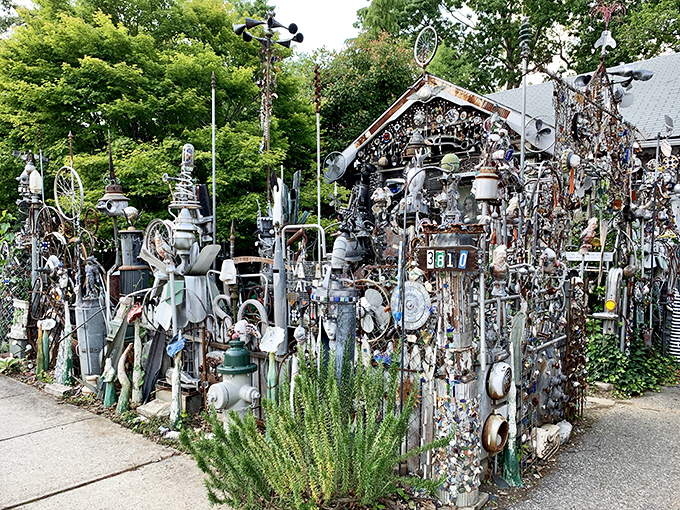 The front yard fortress of fantastical metal—where your neighbor's "junk" becomes a suburban Guggenheim that would make Tim Burton jealous.
