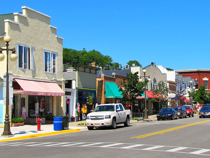 Main Street magic at its finest—colorful awnings, historic facades, and that unmistakable small-town charm that makes you want to slow down and stay awhile.