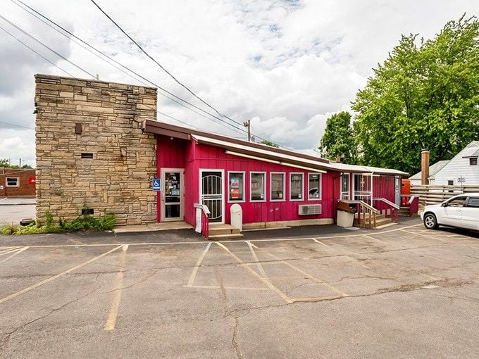 That red exterior isn't just paint – it's a beacon calling every milkshake lover within fifty miles.