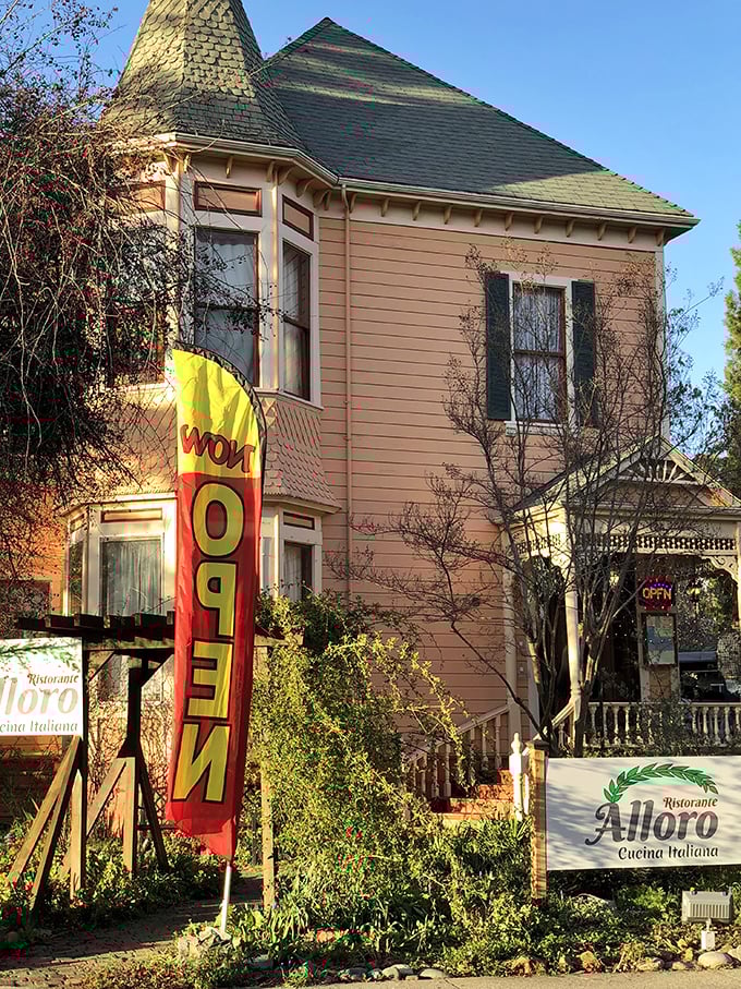 Alloro's Victorian charm and "OPEN" flag signal the kind of authentic Italian dining experience that makes passport stamps unnecessary. 