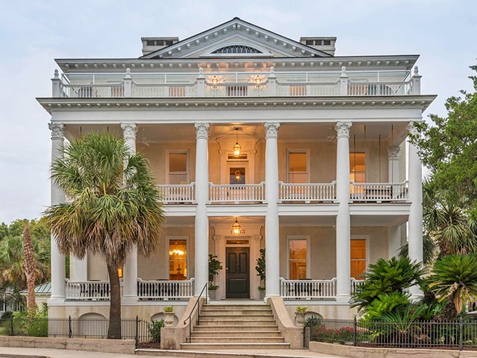 The Anchorage 1770 glows with Southern elegance as dusk approaches. Columns, porches, and palm trees—the architectural equivalent of a perfect mint julep.