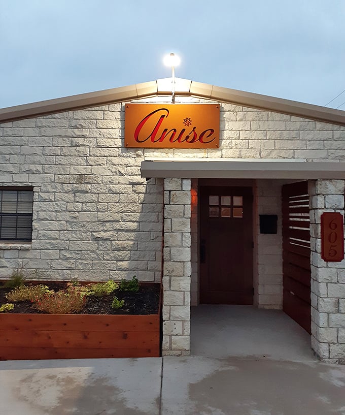 Anise isn't just a restaurant—it's a limestone love letter to Texas cuisine that glows with invitation when the sun goes down.