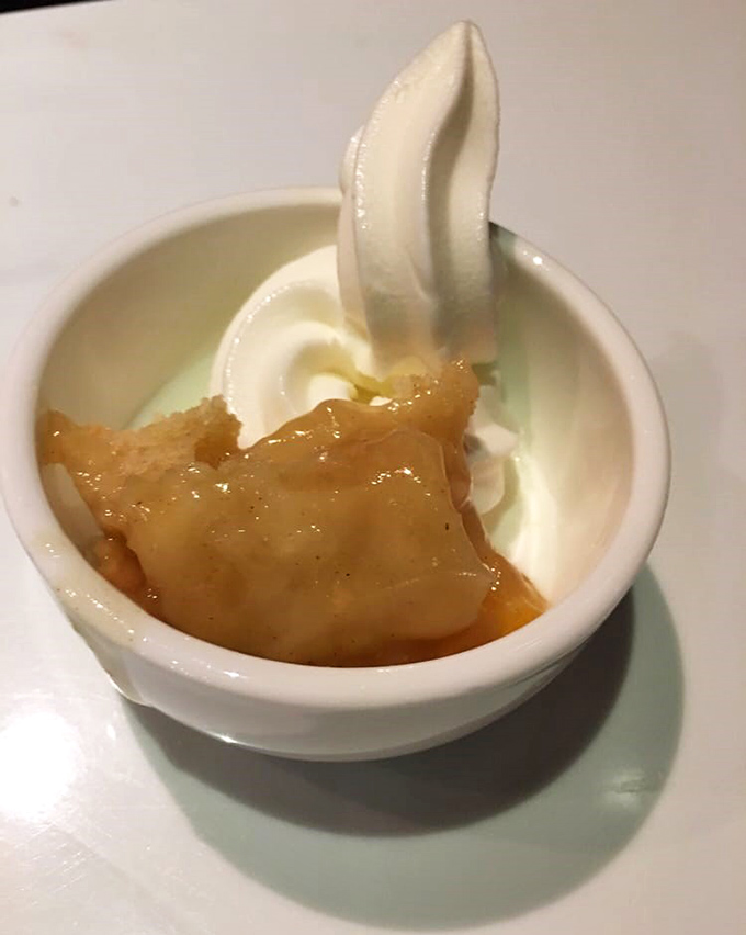 Vanilla ice cream melts into warm apple cobbler, creating that magical temperature contrast that makes dessert not just a course, but an experience.