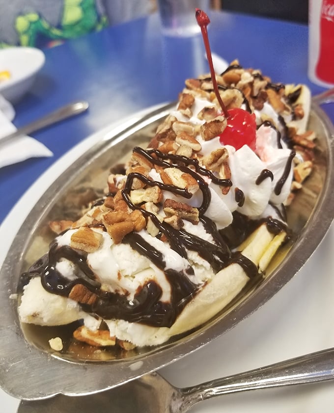 A banana split that doesn't just satisfy your sweet tooth—it throws a party for it. Whipped cream mountains, chocolate rivers, and that iconic cherry on top.