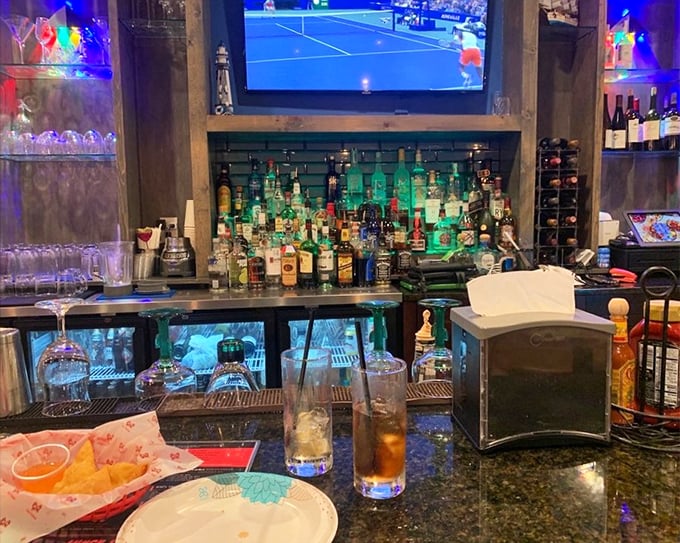 A well-stocked bar ready to quench any thirst that seafood spices might ignite. Liquid reinforcements for your culinary adventure.