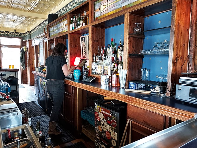 Behind every great tavern is a bar that tells stories – this one whispers tales of first dates, celebrations, and conversations that changed lives.