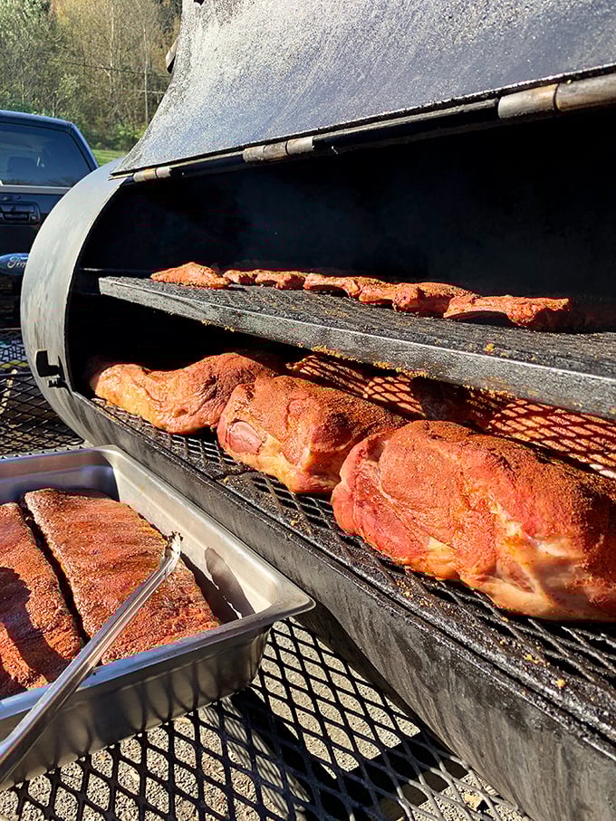 The smoker—barbecue's holy temple where time, temperature, and wood create magic. Those meats are getting the VIP treatment they deserve.