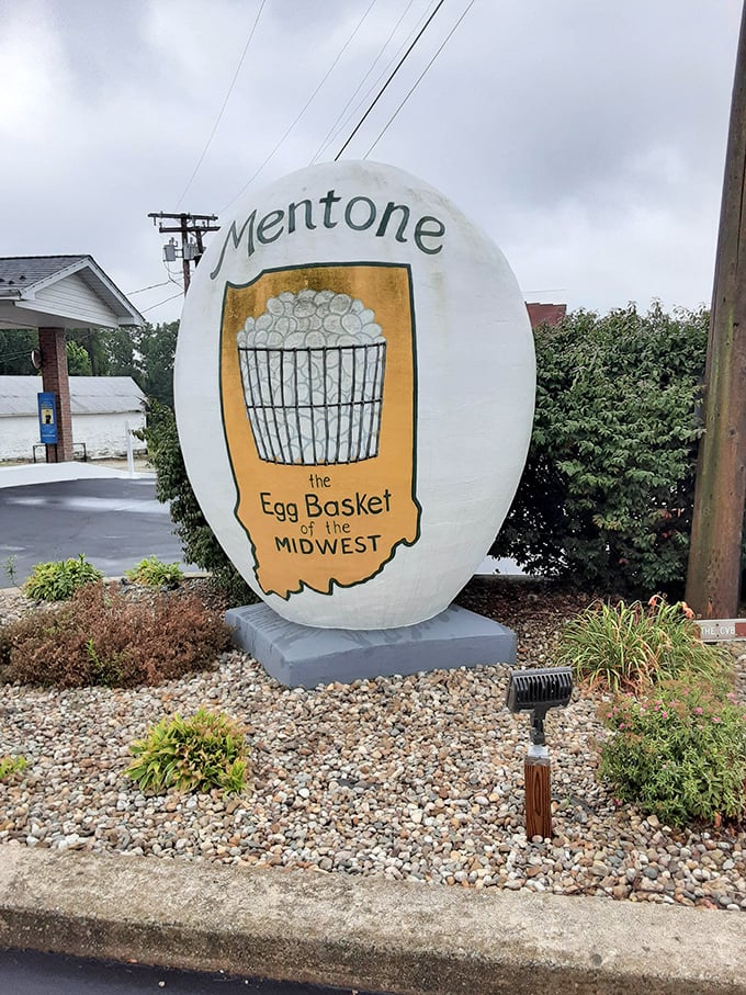Against moody Indiana skies, the egg stands as a beacon of small-town identity – unchanging while clouds drift by.