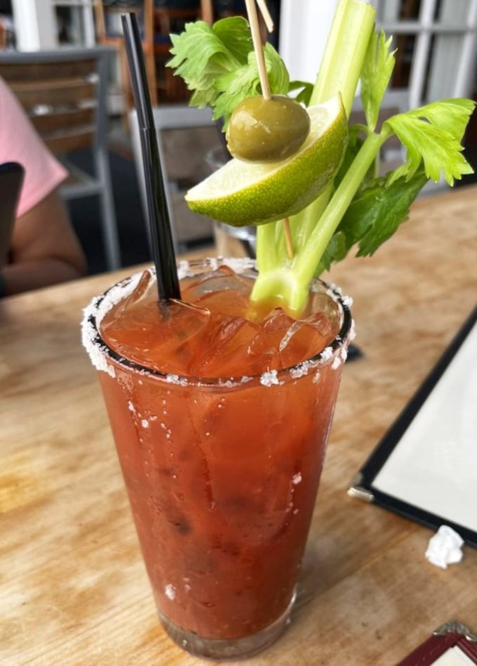 This Bloody Mary isn't just a drink, it's a garden in a glass with enough garnish to count as a small salad course.