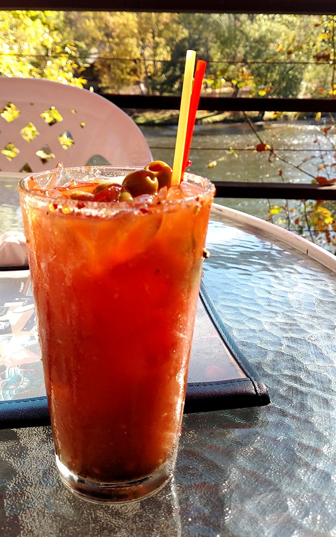 A Bloody Mary with a view—spicy, tangy, and garnished with enough olives to count as a salad course.
