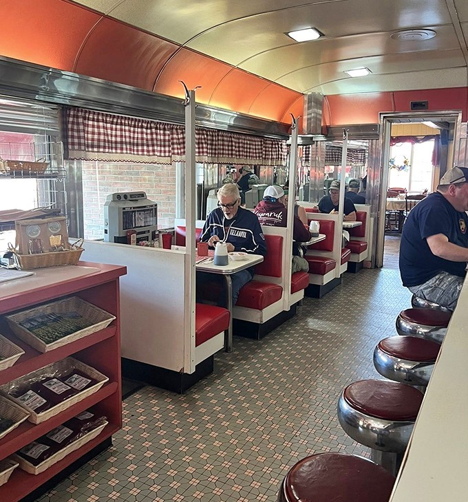 Classic diner booths where strangers become neighbors and the checkered curtains frame conversations worth having.