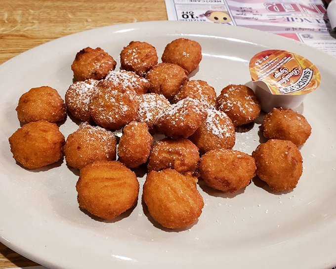 These golden-fried treasures aren't just breaded scallops – they're little orbs of joy dusted with powdered sugar, waiting to trigger childhood memories.
