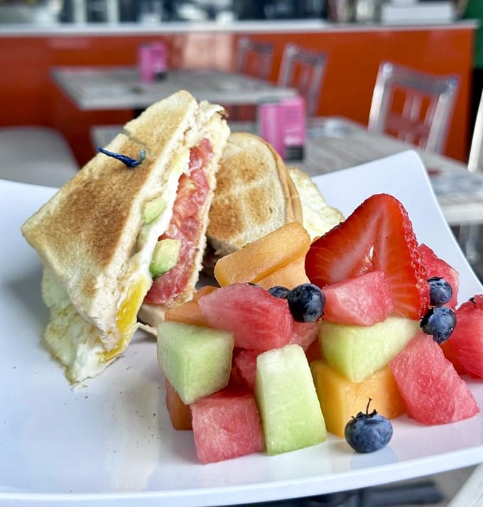 Breakfast reimagined with island flair. That fruit medley isn't just a side—it's nature's candy bringing sunshine to your morning.